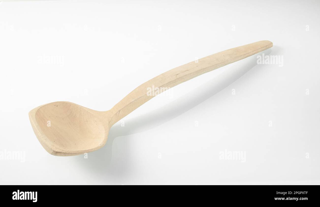 Wooden kitchen utensils.Wooden ladle for soup on a white background ...