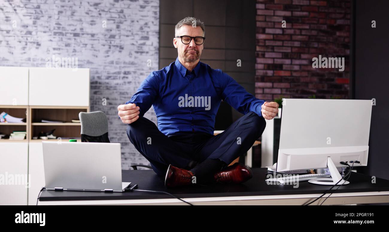 Employee Doing Mental Health Yoga Meditation In Office Stock Photo - Alamy