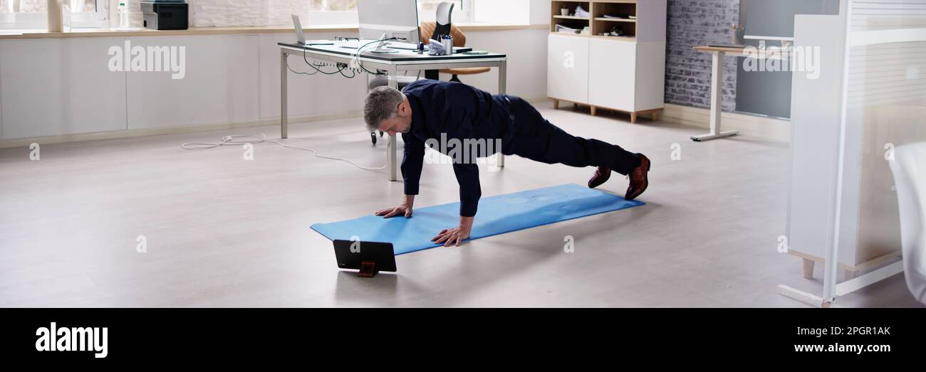 Burpee Training Exercise In Office. Man Jumping Stock Photo - Alamy