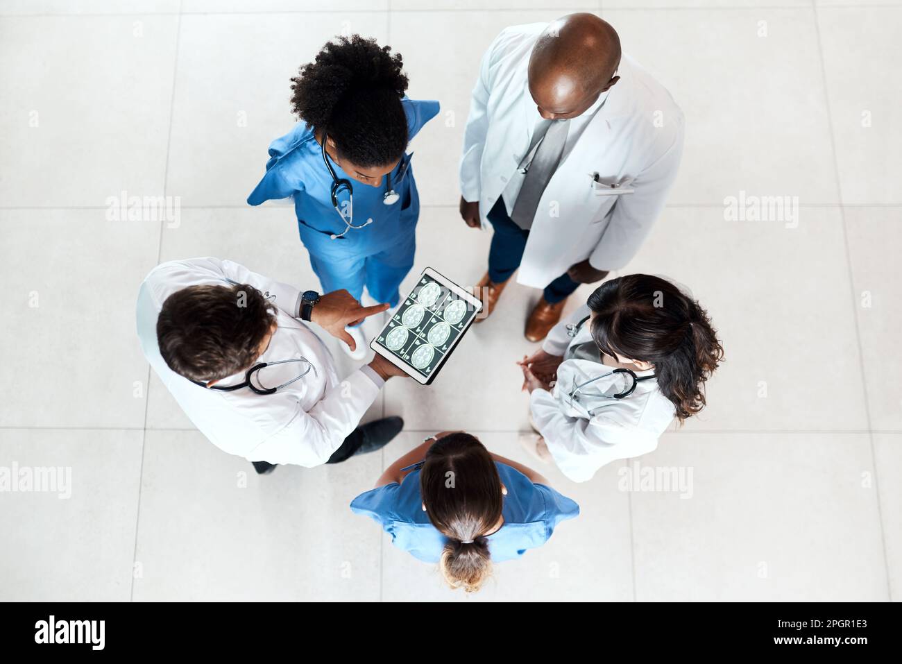 Taking on the diagnosis with digital tech. High angle shot of a team of ...