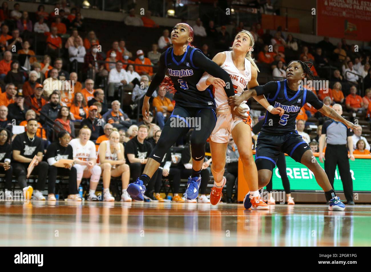 BOWLING GREEN, OH - MARCH 23: Bowling Green Falcons guard Elissa Brett (5), center, battles for ...