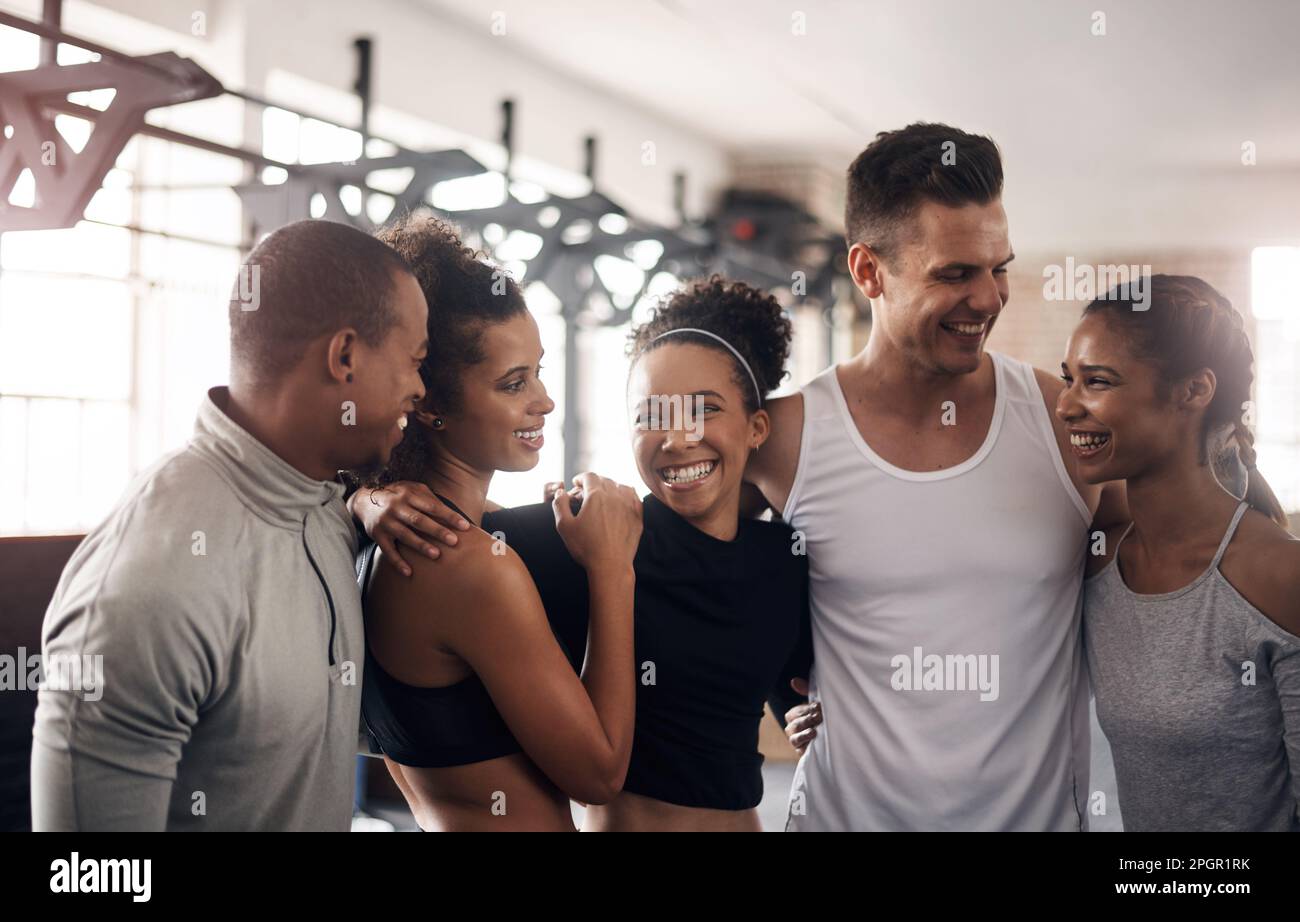 The squad who gyms together stays together. a group of happy young ...