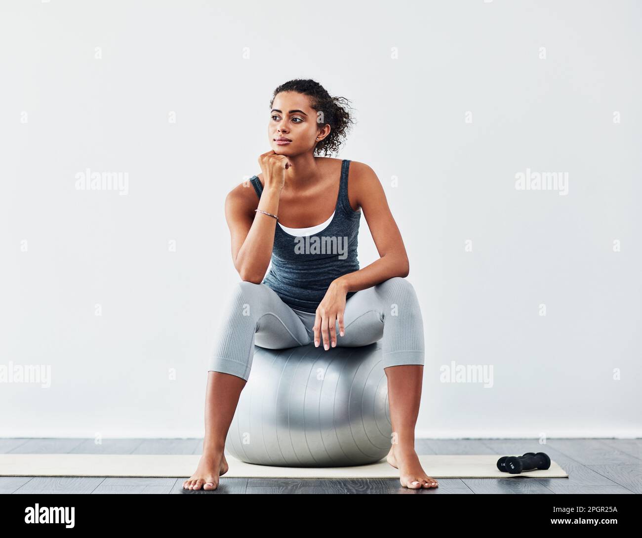 Taking care of yourself is not optional. a sporty young woman sitting ...