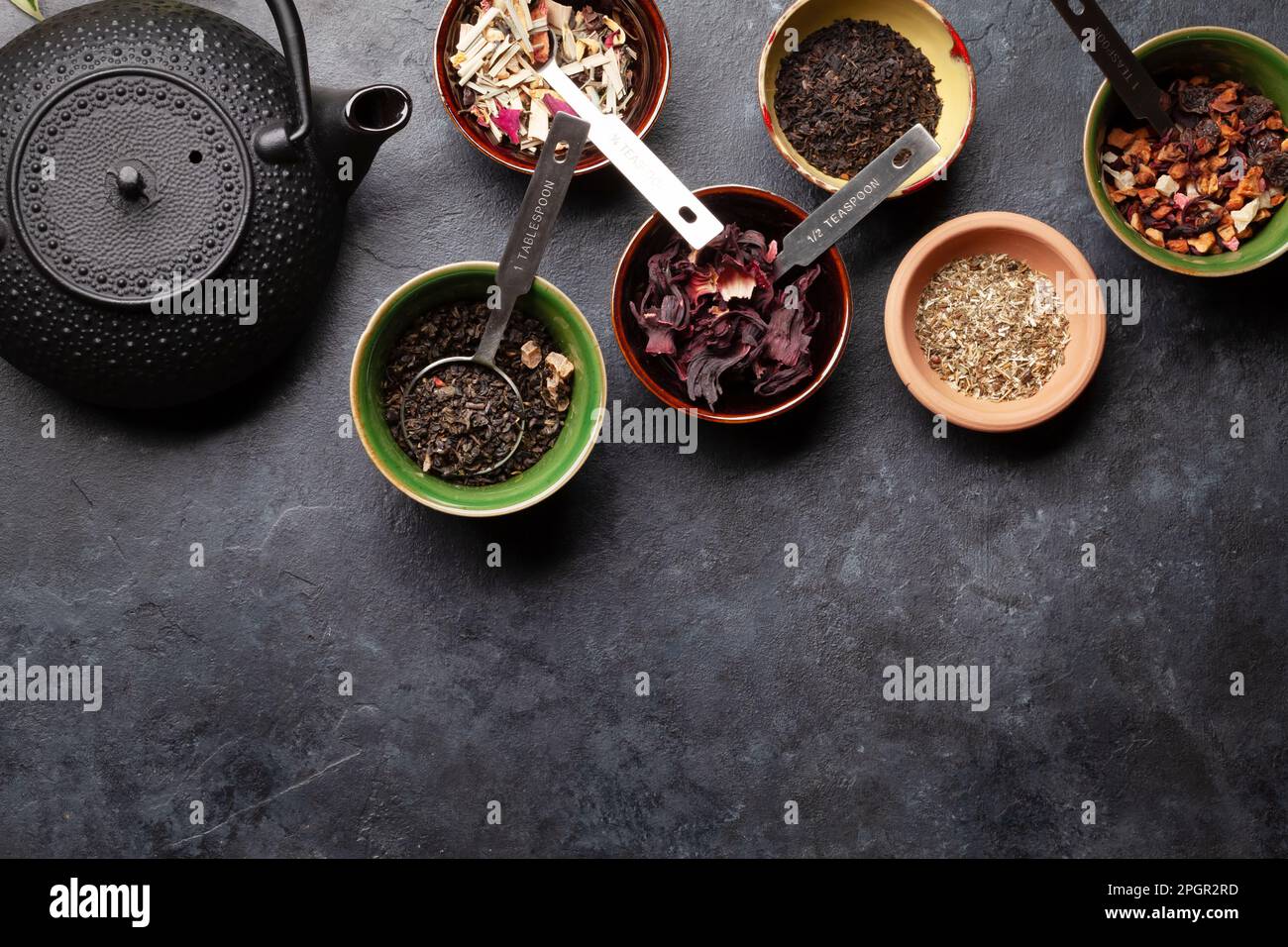 Various dried tea and teapot. Top view flat lay with copy space Stock ...