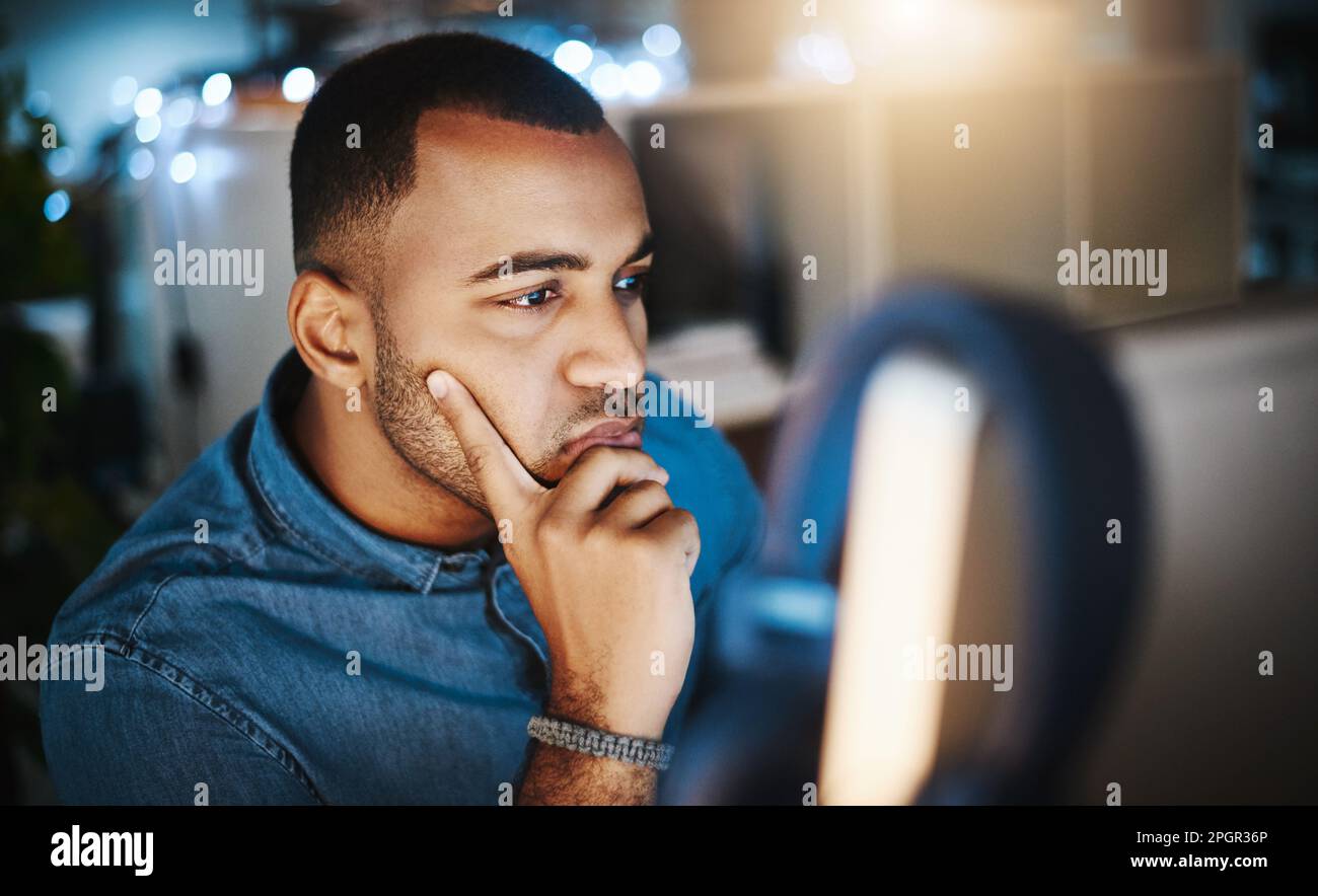 He makes it work no matter the hour. a young businessman using a ...