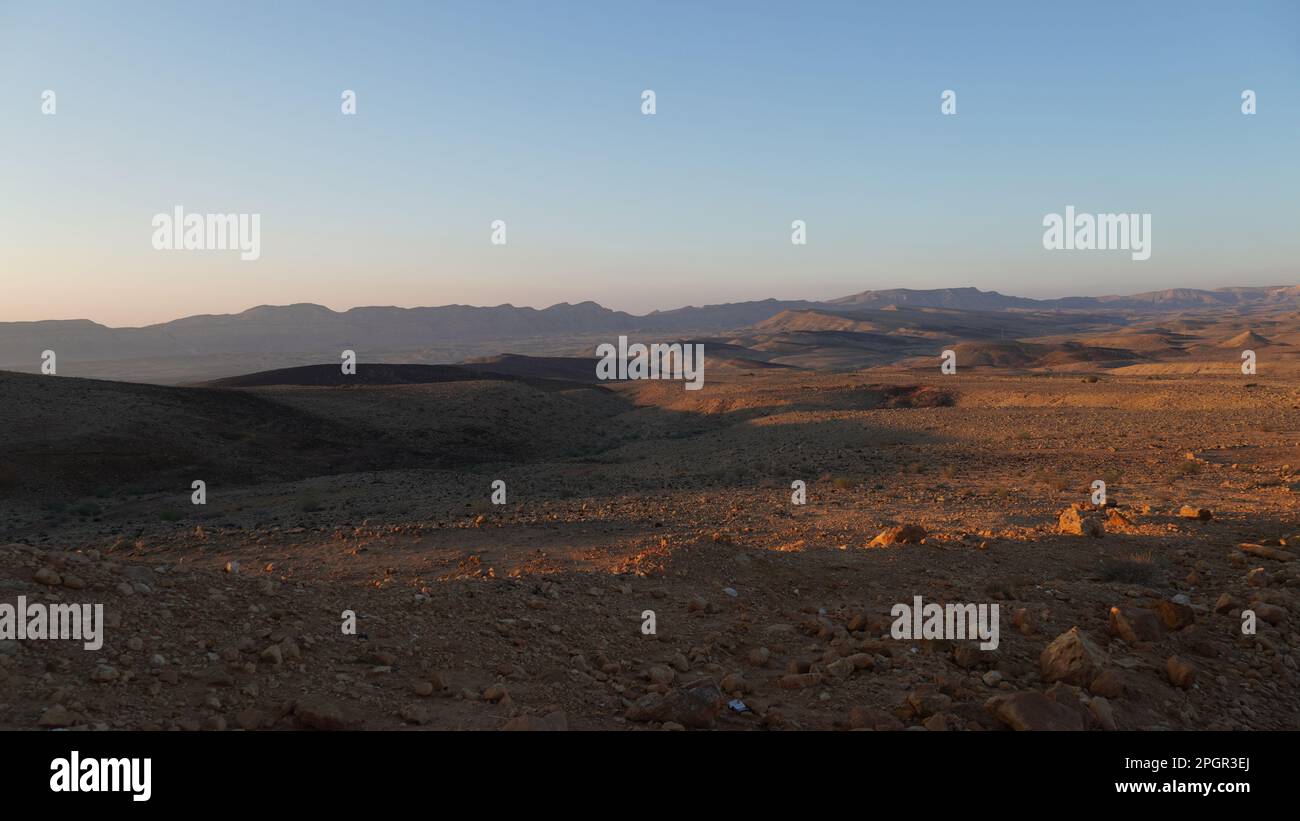 Negev desert landscape at sunrise on the bottom of the crater Makhtesh ...