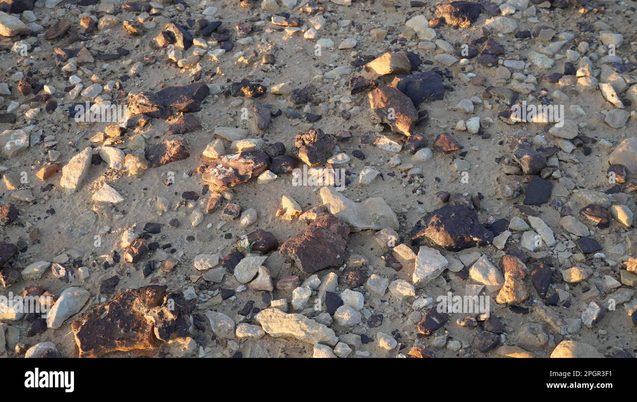 Natural rocks, volcanic rock on the bottom of the crater Makhtesh Gadol ...