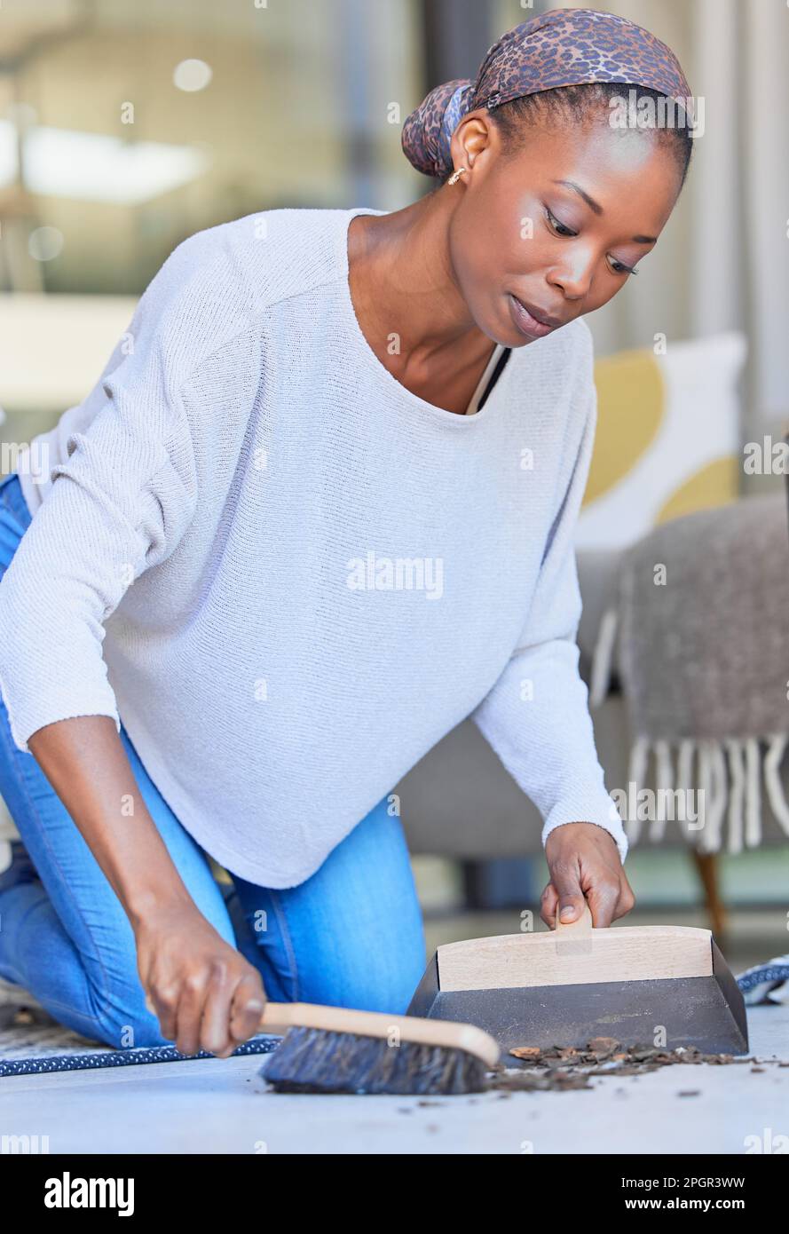 Maid, housekeeping and black woman cleaning and sweeping floor of a ...