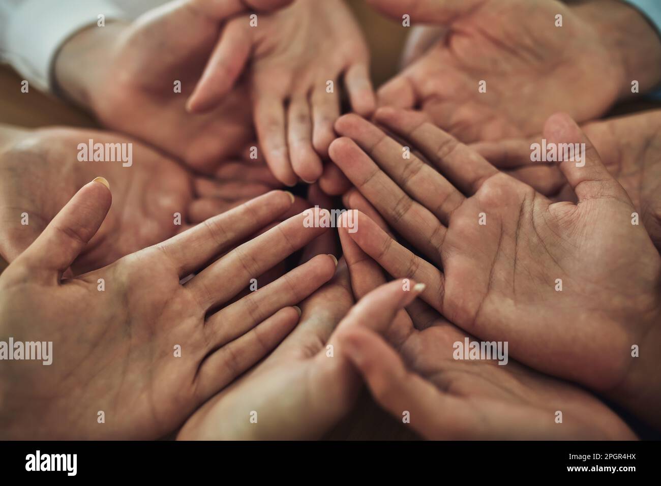 Please help us. a group of businesspeople with their hands opened Stock ...