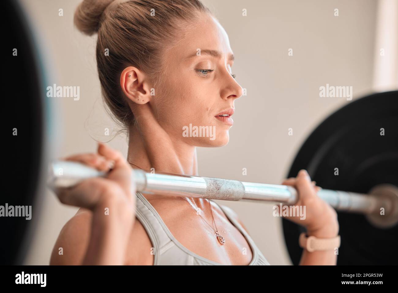 Fitness, bodybuilding and a woman weightlifter in the gym for a workout ...