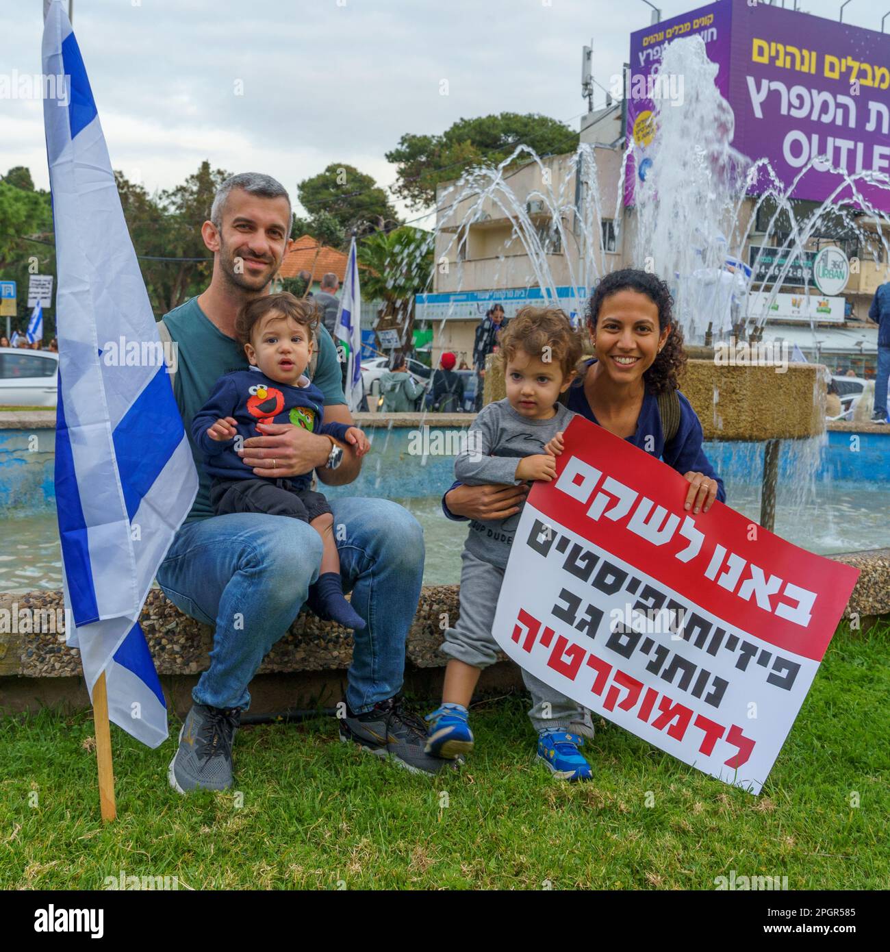 Haifa, Israel - March 23, 2023: Protesters with various signs and flags ...