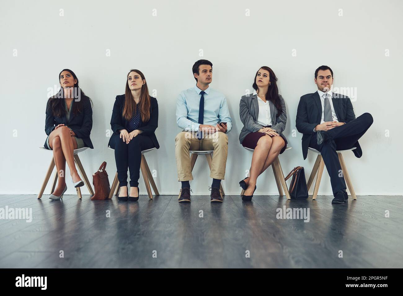 When the wait feels torturous. Studio shot of a group of businesspeople ...
