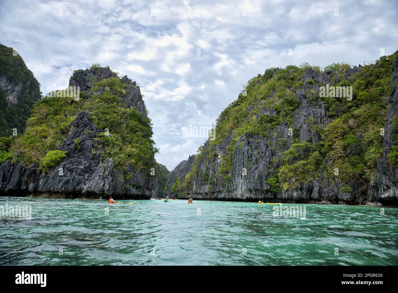 A bay with majestic rocks in El Nido, Palawan in the Philippines that ...