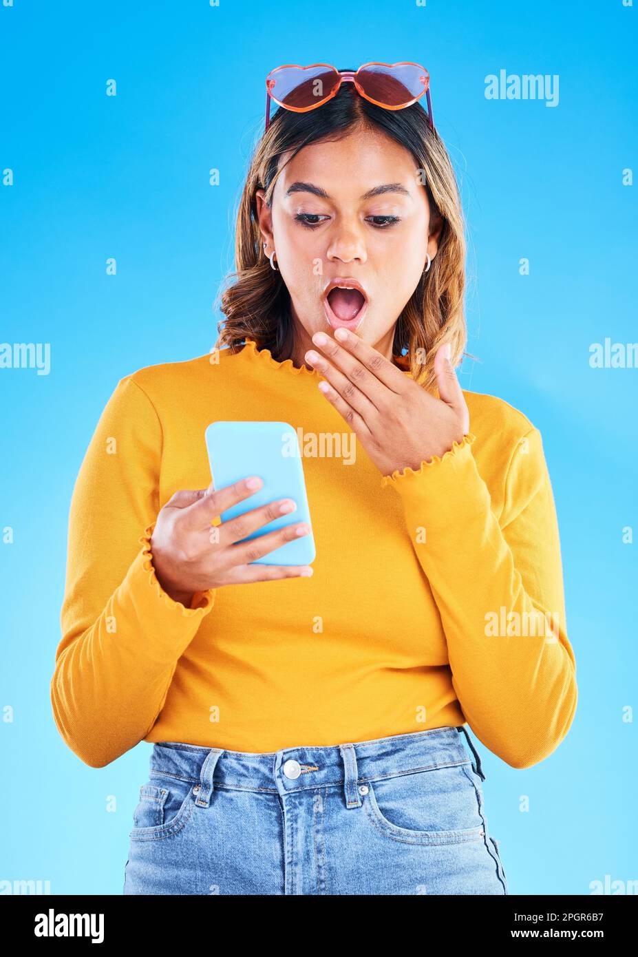 Notification, shocked and woman surprised by phone due to trending ...
