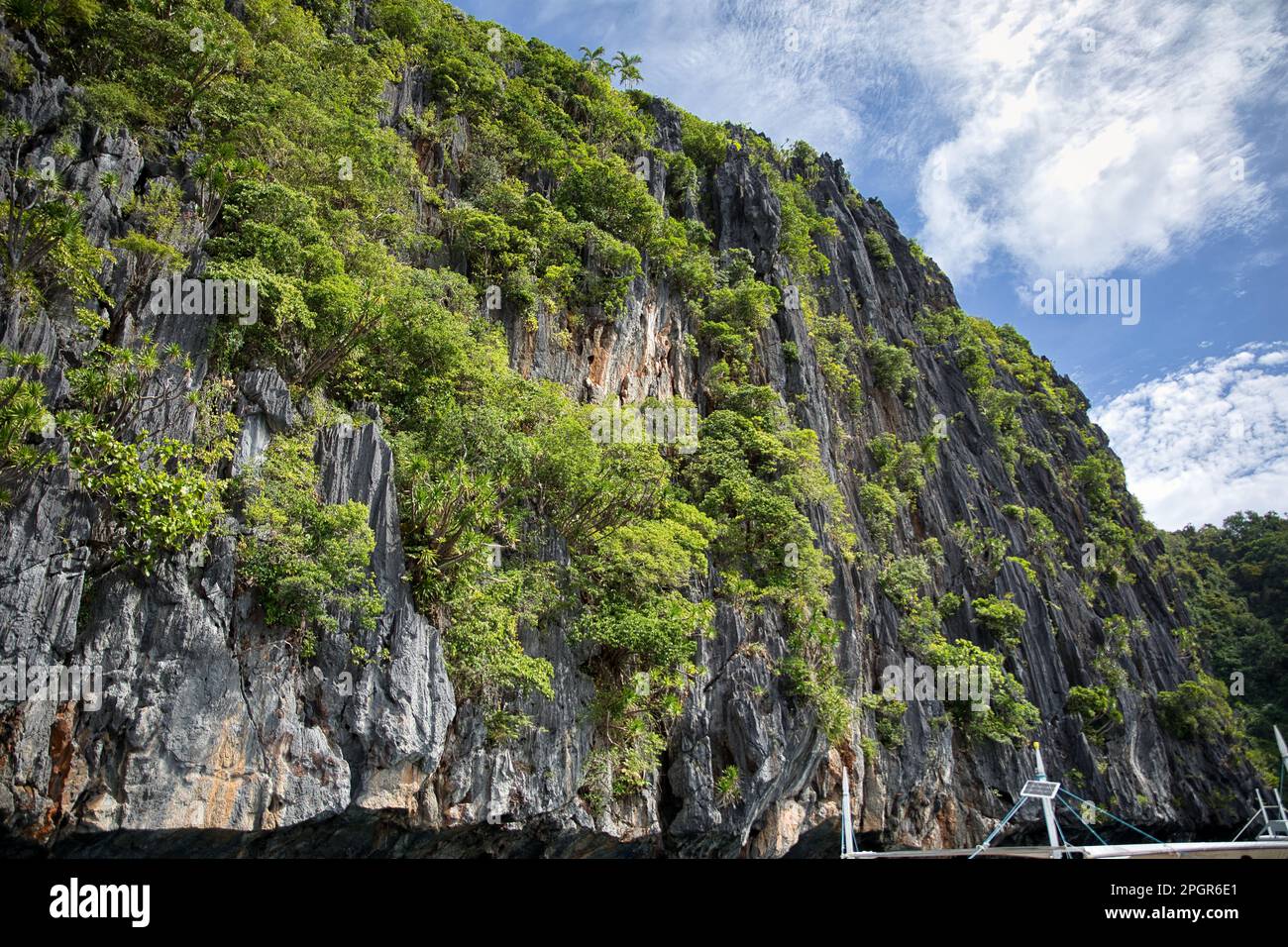 A majestic rock in El Nido, Palawan in the Philippines that is covered ...