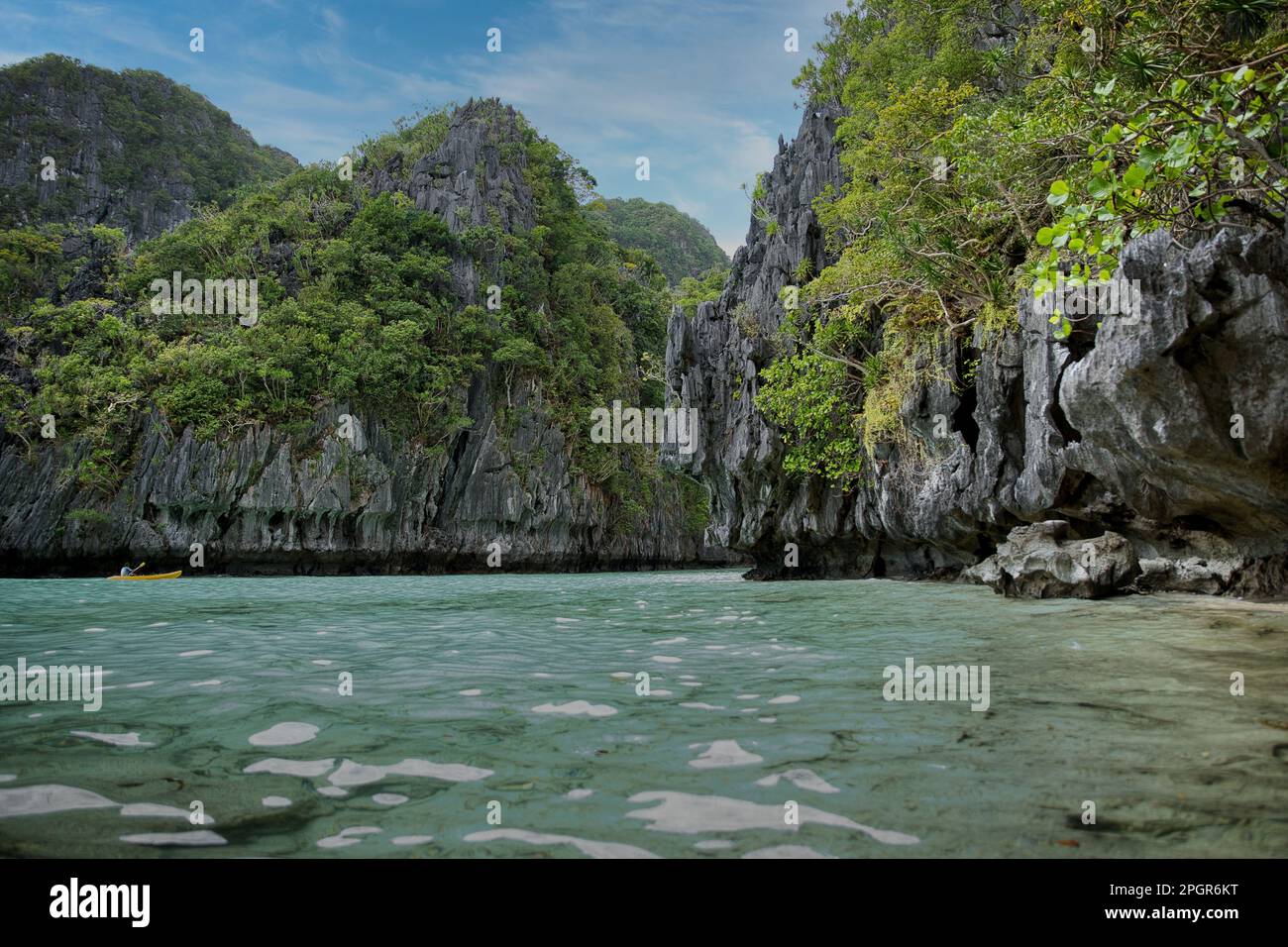 A bay with majestic rocks in El Nido, Palawan in the Philippines that ...