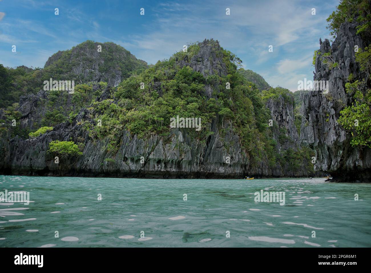 A bay with majestic rocks in El Nido, Palawan in the Philippines that ...