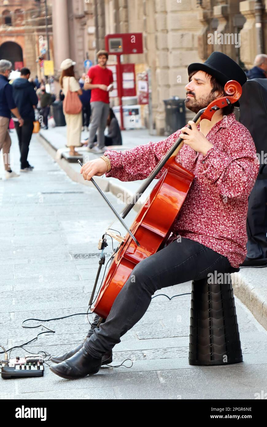 Street performer, playing cello in the historic downtown district of ...