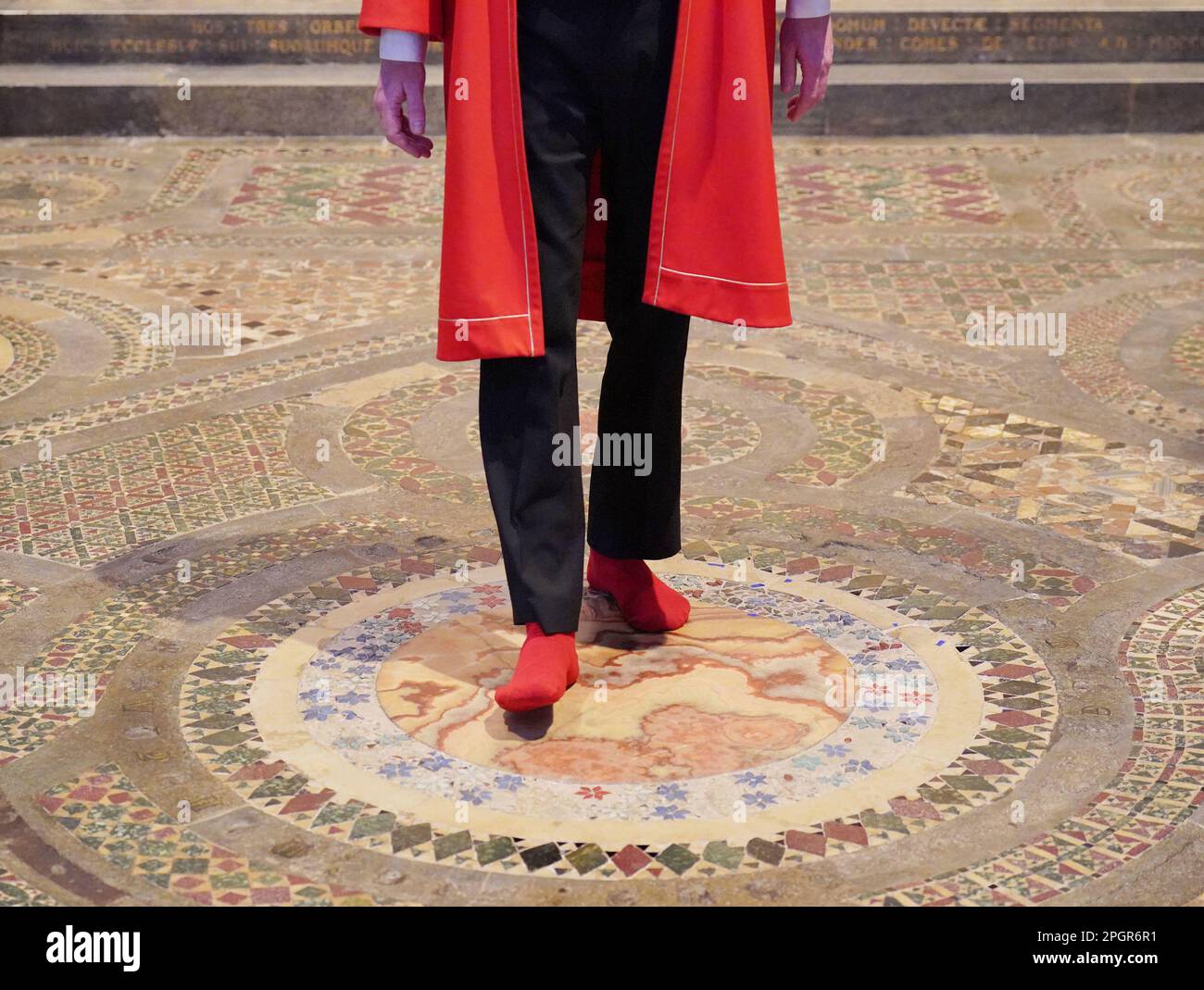 Abbey Marshal Howard Berry walks across the centre of the Cosmati ...