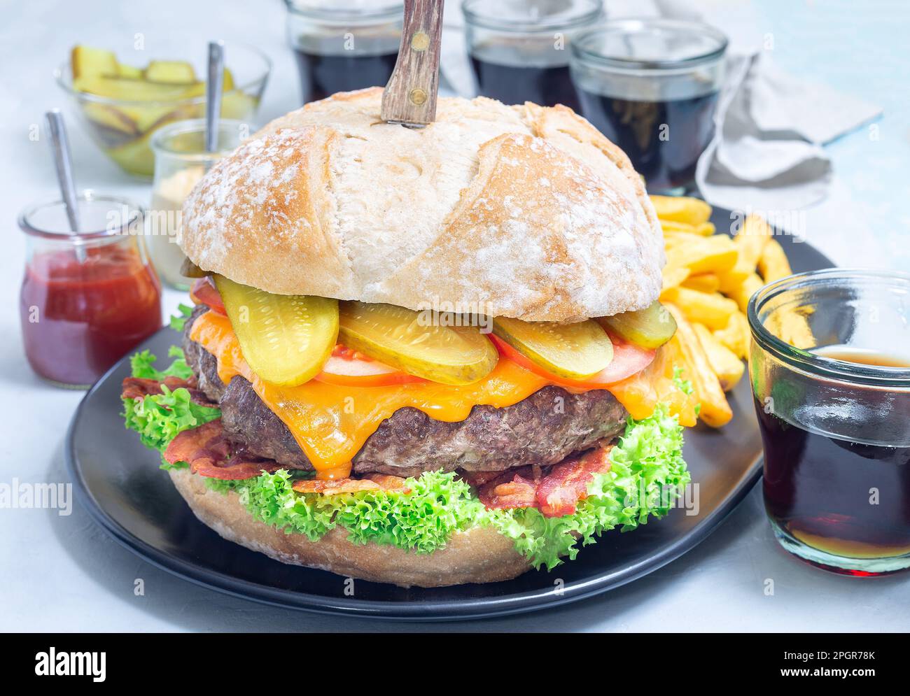Giant homemade cheeseburger for burger party, made on bread, with ...