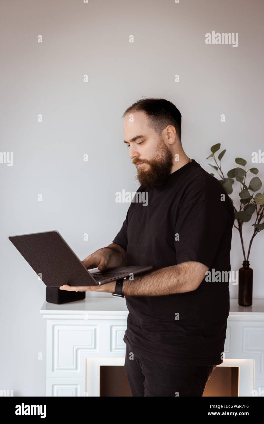Man working remoetly from the comfort of his own home Stock Photo - Alamy