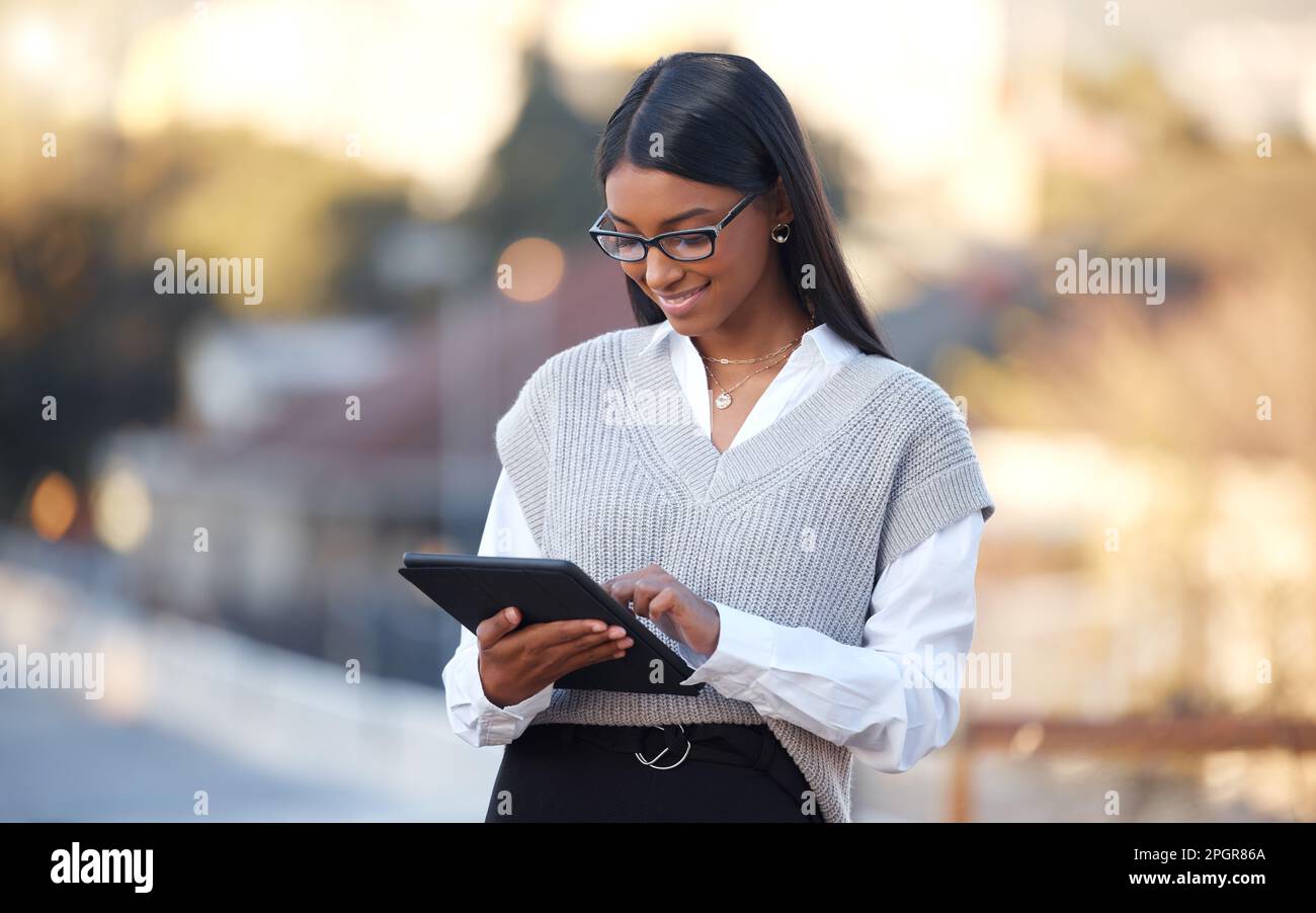 Woman, tablet and typing in street with smile for texting, social media ...