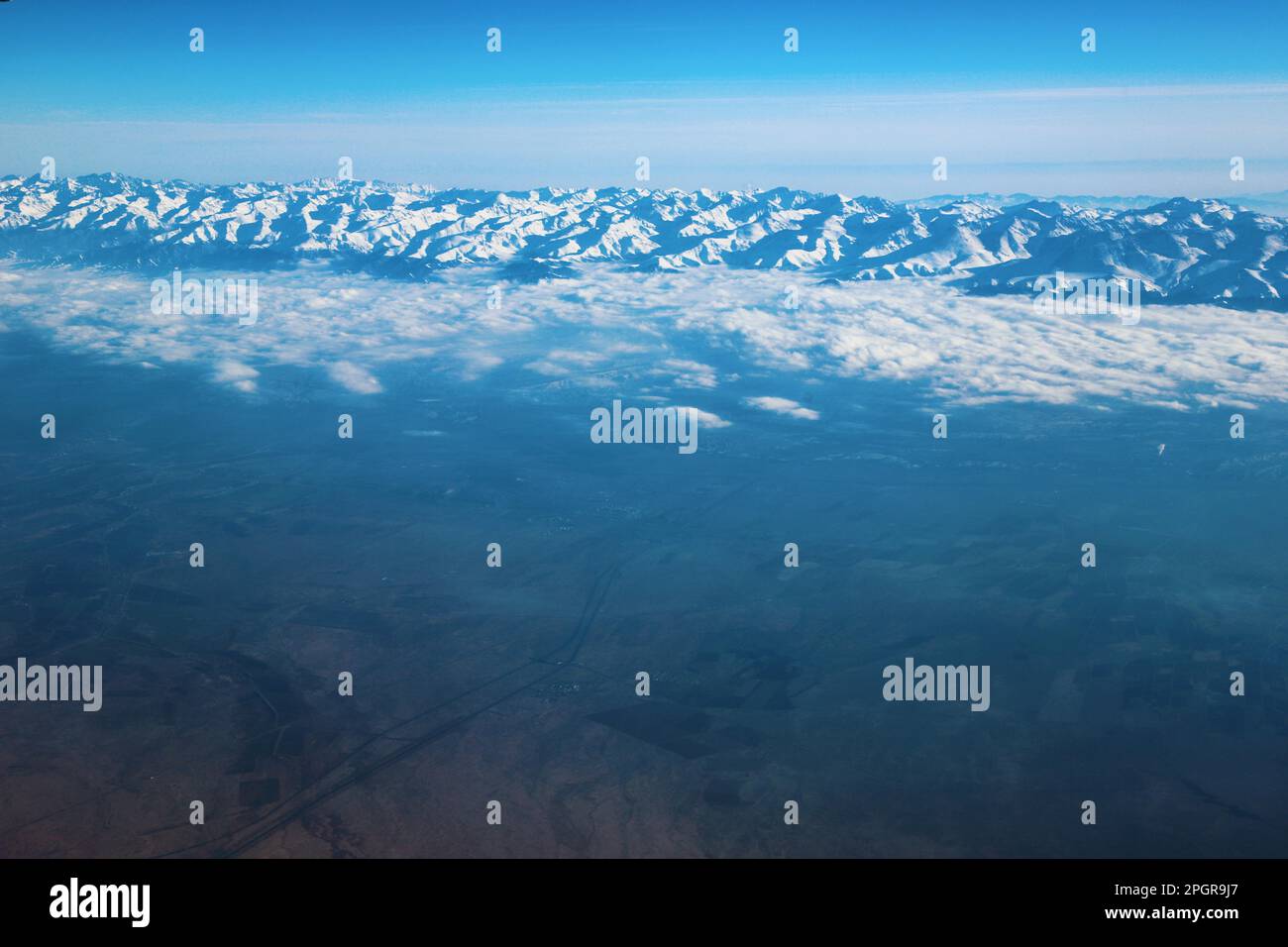 Aerial photo shows the landscape of snow-covered mountain range of ...