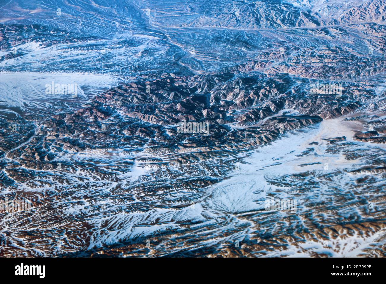 Aerial photo shows the landscape of snow-covered mountain range of ...