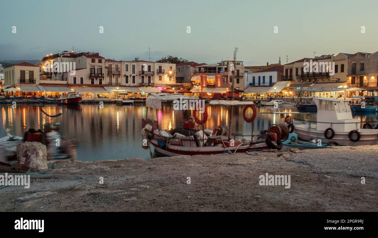 Harbour area Rethymnon, Crete, Greece with lights coming on as the ...