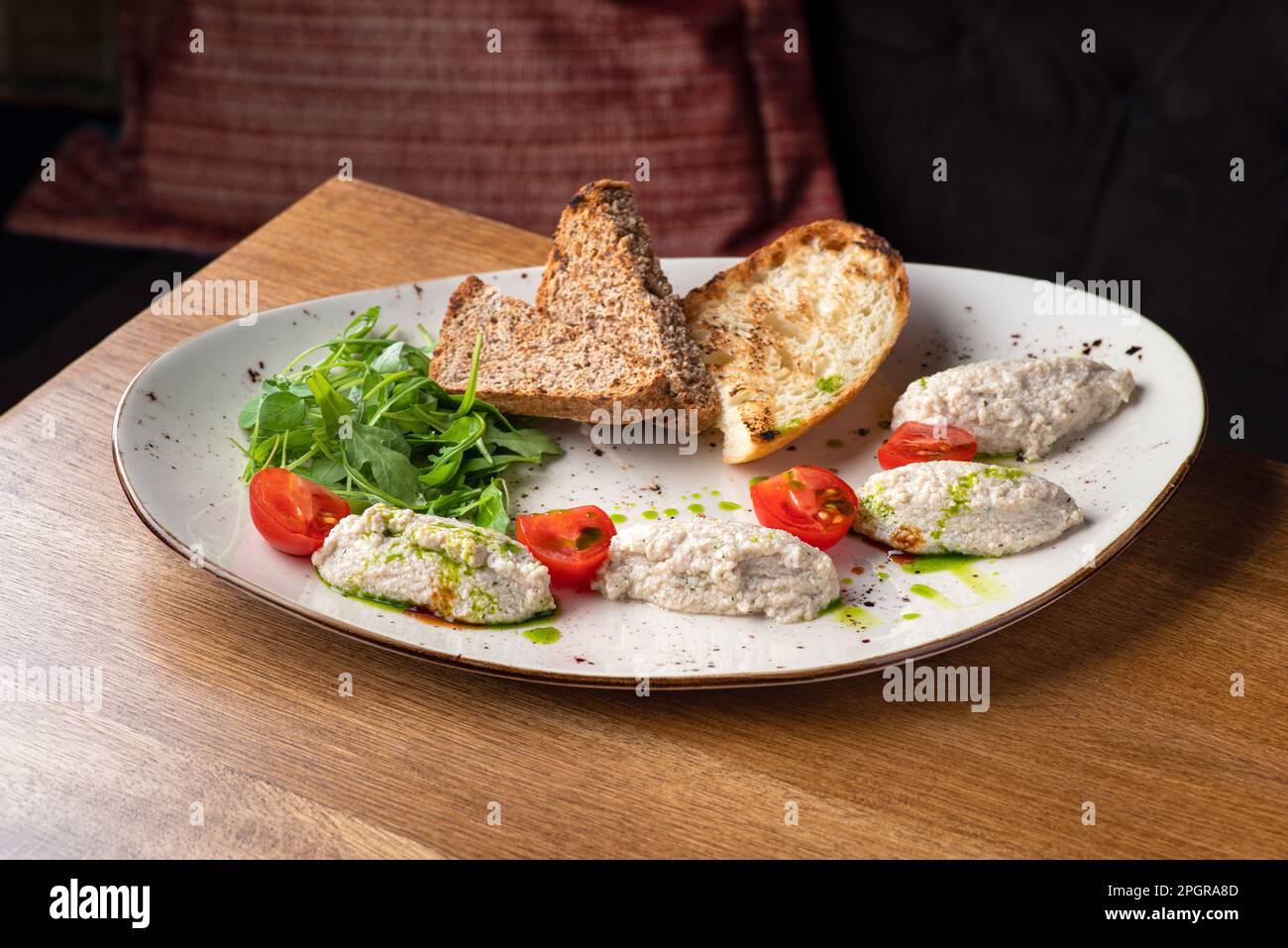 Cod liver pate with brown bread on plate. Homemade spread made from cod ...