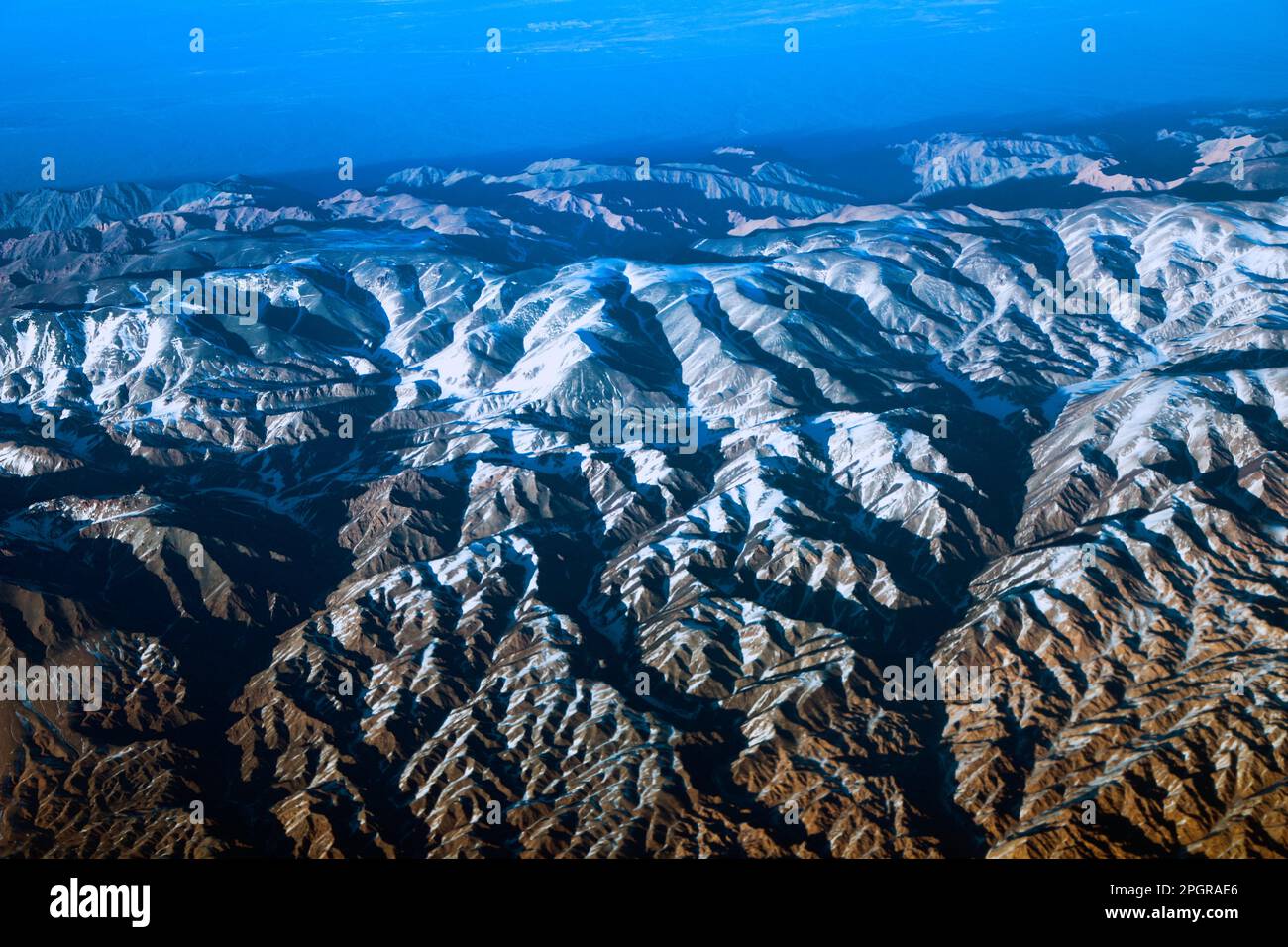 Aerial photo shows the landscape of snow-covered mountain range of ...