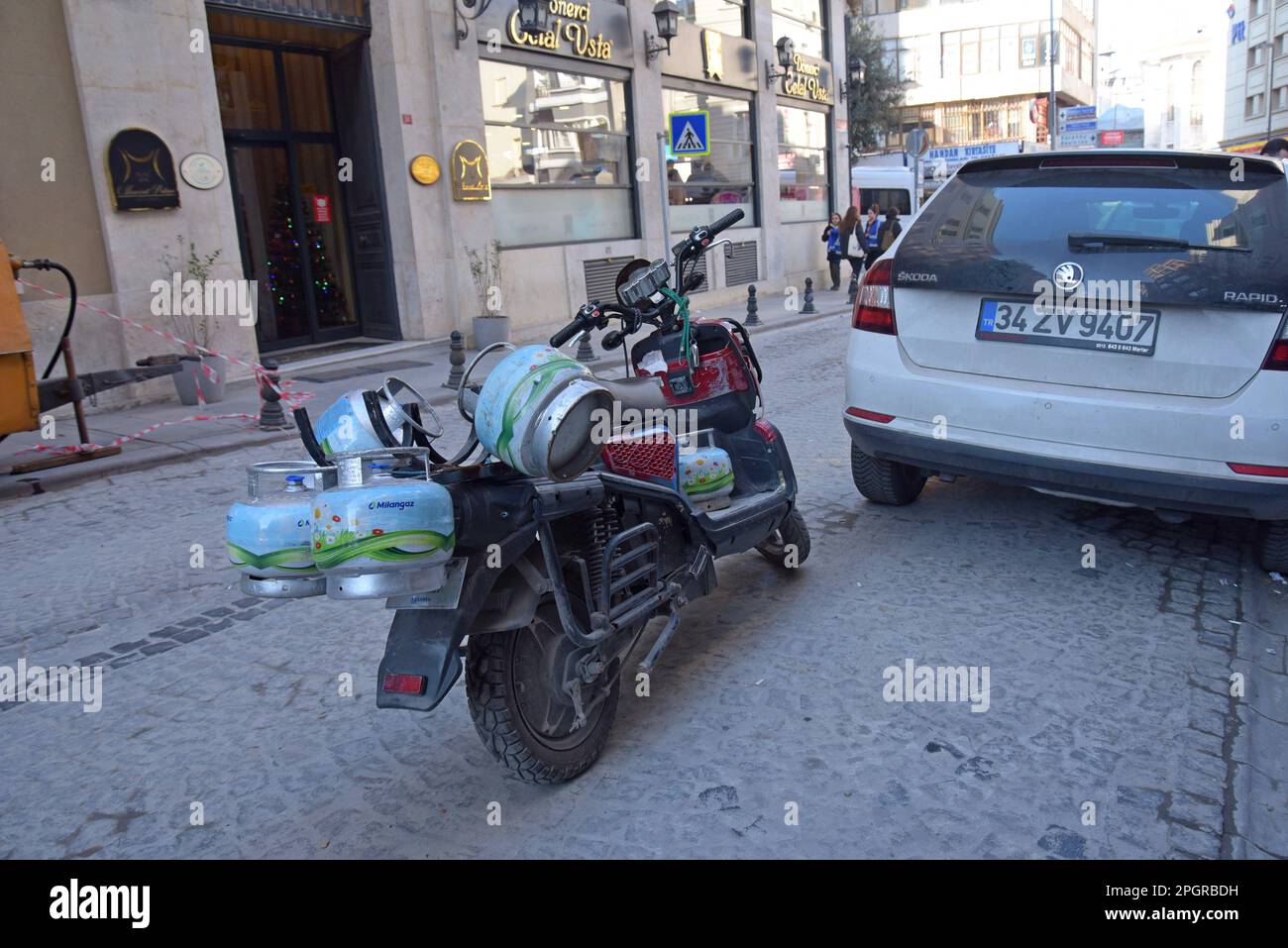 A moped fitted with racks for delivering propane gas bottles, Istanbul ...