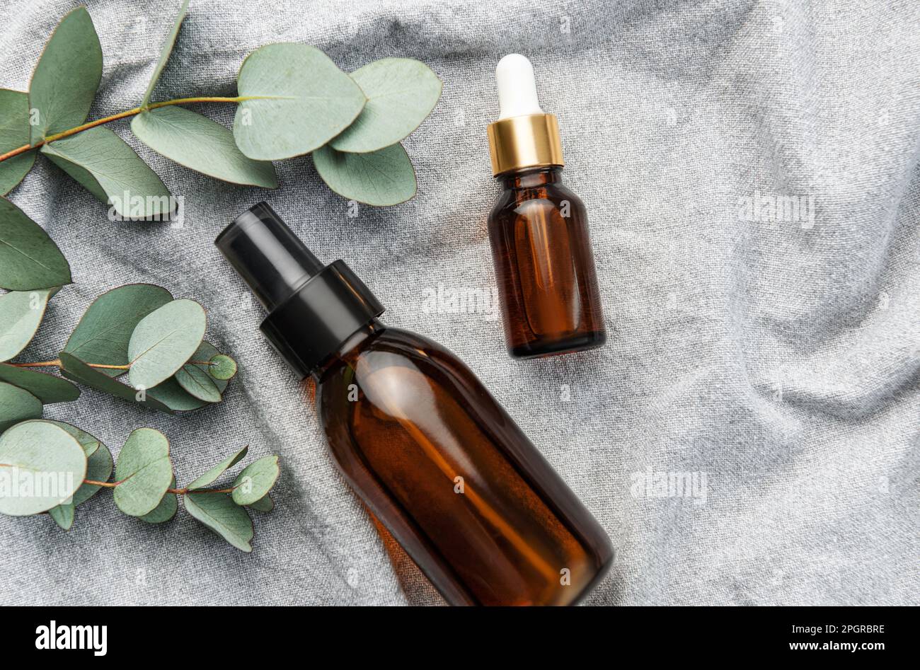 Massage and Spa products with eucalyptus on a textile fabric background ...