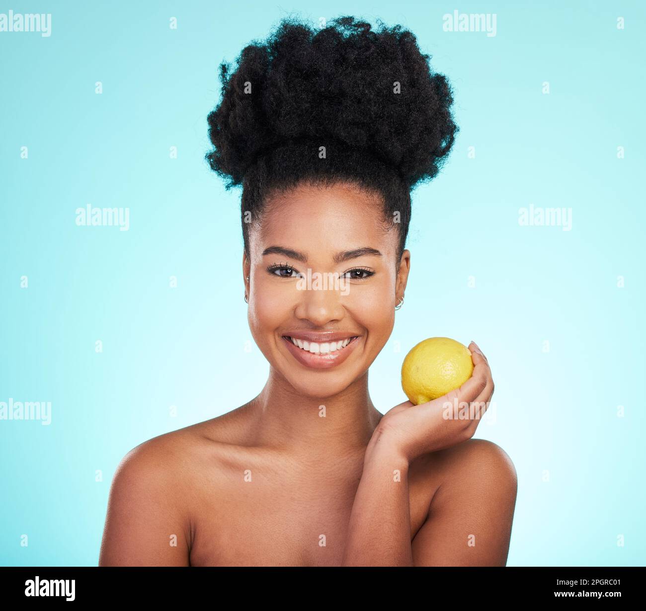 Lemon beauty, portrait and happy black woman in studio, blue background ...