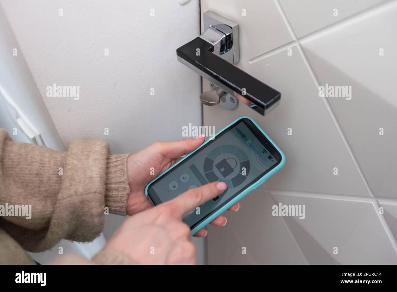 Woman hands using phone scan to digital door lock security systems at ...