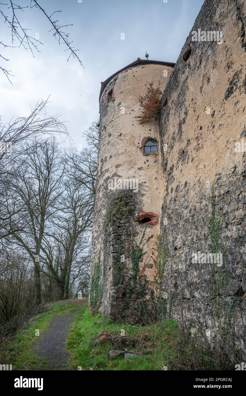 Old castle wall with tower, view from low angle during cloudy day ...