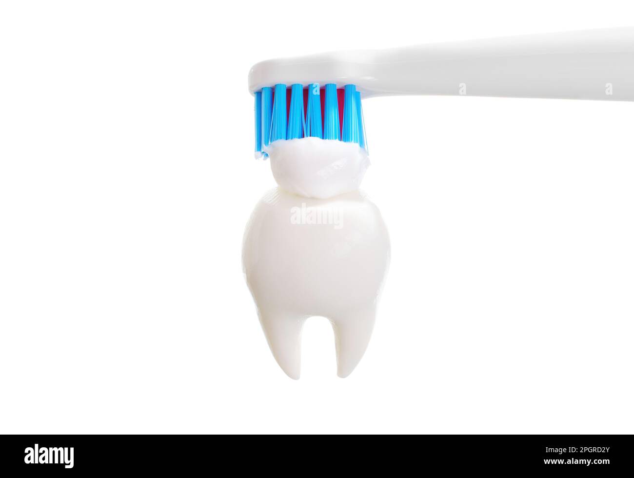 Close-up view of an electric toothbrush applying toothpaste to a tooth ...