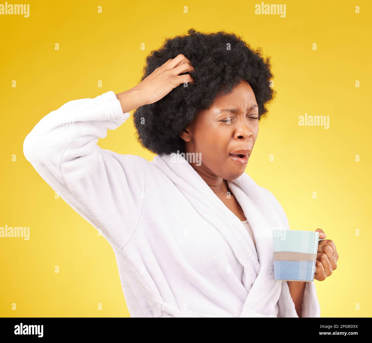 Coffee, yawning and tired black woman in studio, waking up in the ...