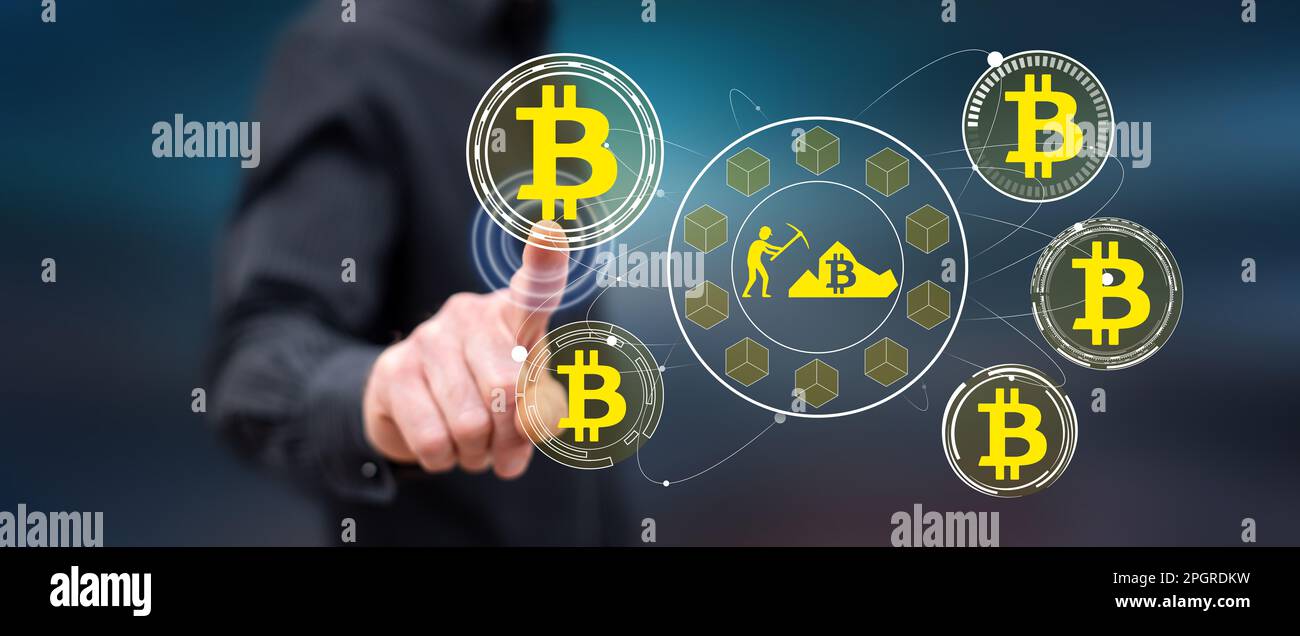 Man touching a bitcoin mining concept on a touch screen with his finger ...