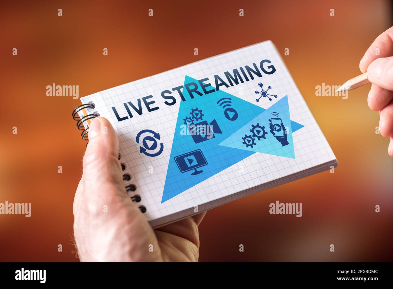 Hand drawing live streaming concept on a notepad Stock Photo - Alamy