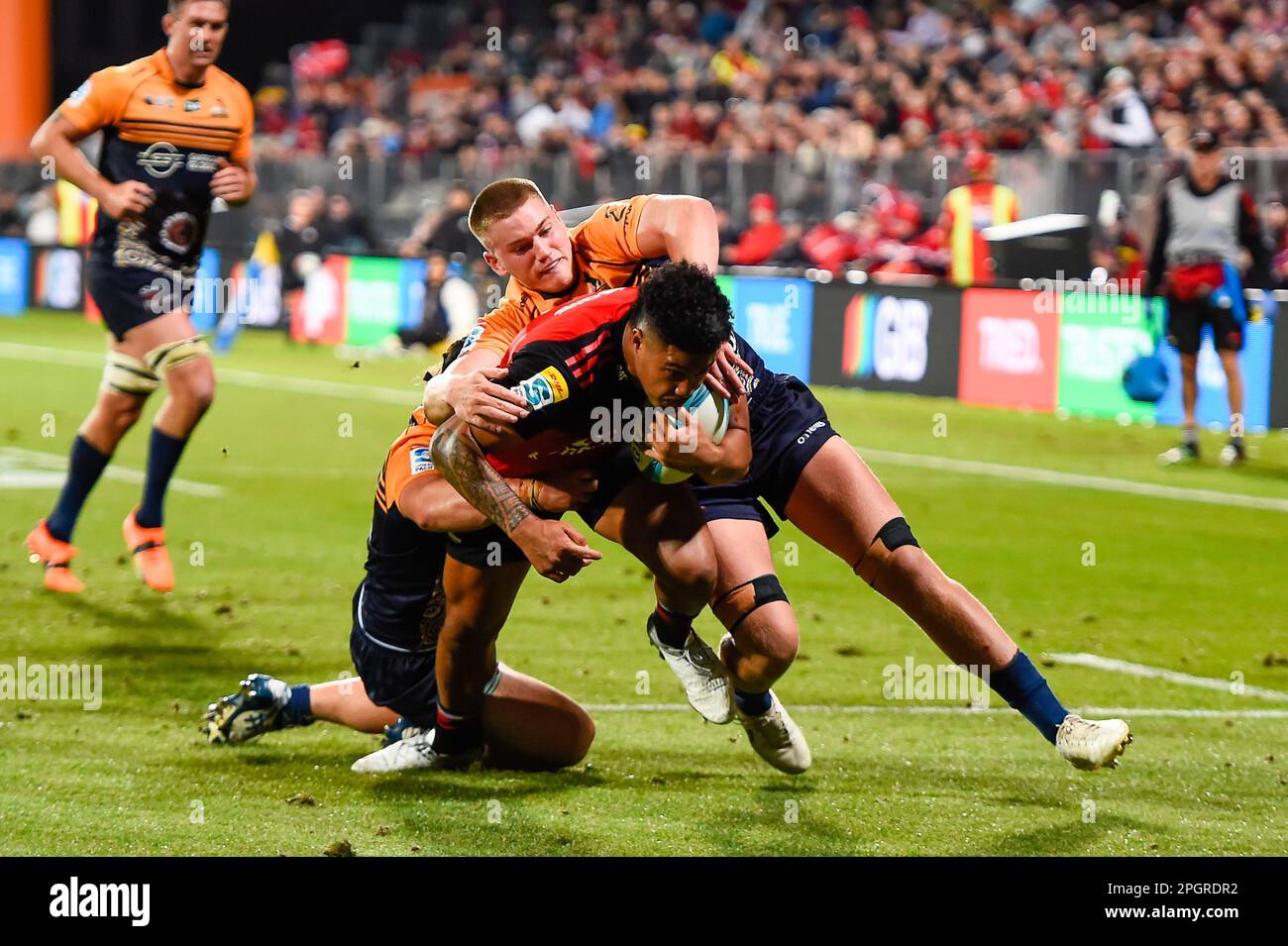 Leicester Faingaanuku of the Crusaders scores a try in the tackle of ...