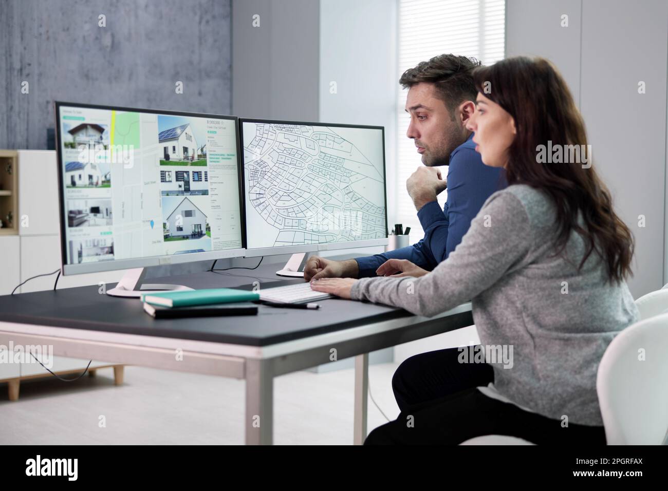 Developer Looking At Land Plot Map And Cadastre Plan Stock Photo - Alamy