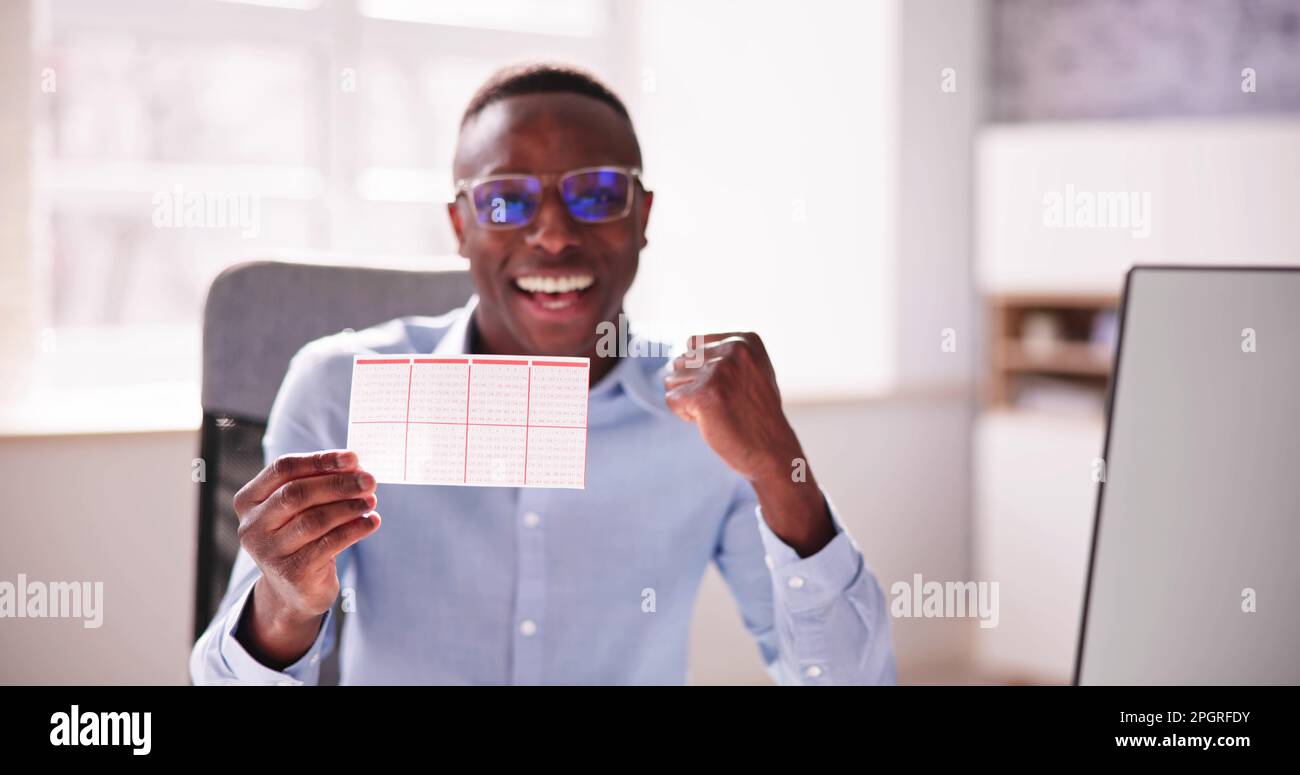 African Lottery Winner Person With Lotto Ticket Stock Photo - Alamy
