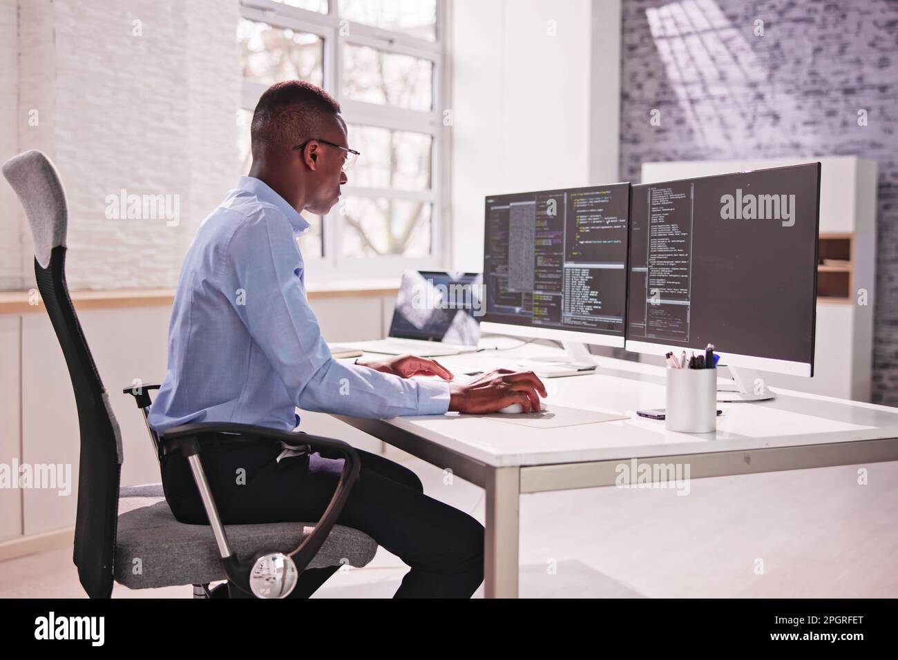African American Man Programmer. Girl Coding On Computer Stock Photo ...
