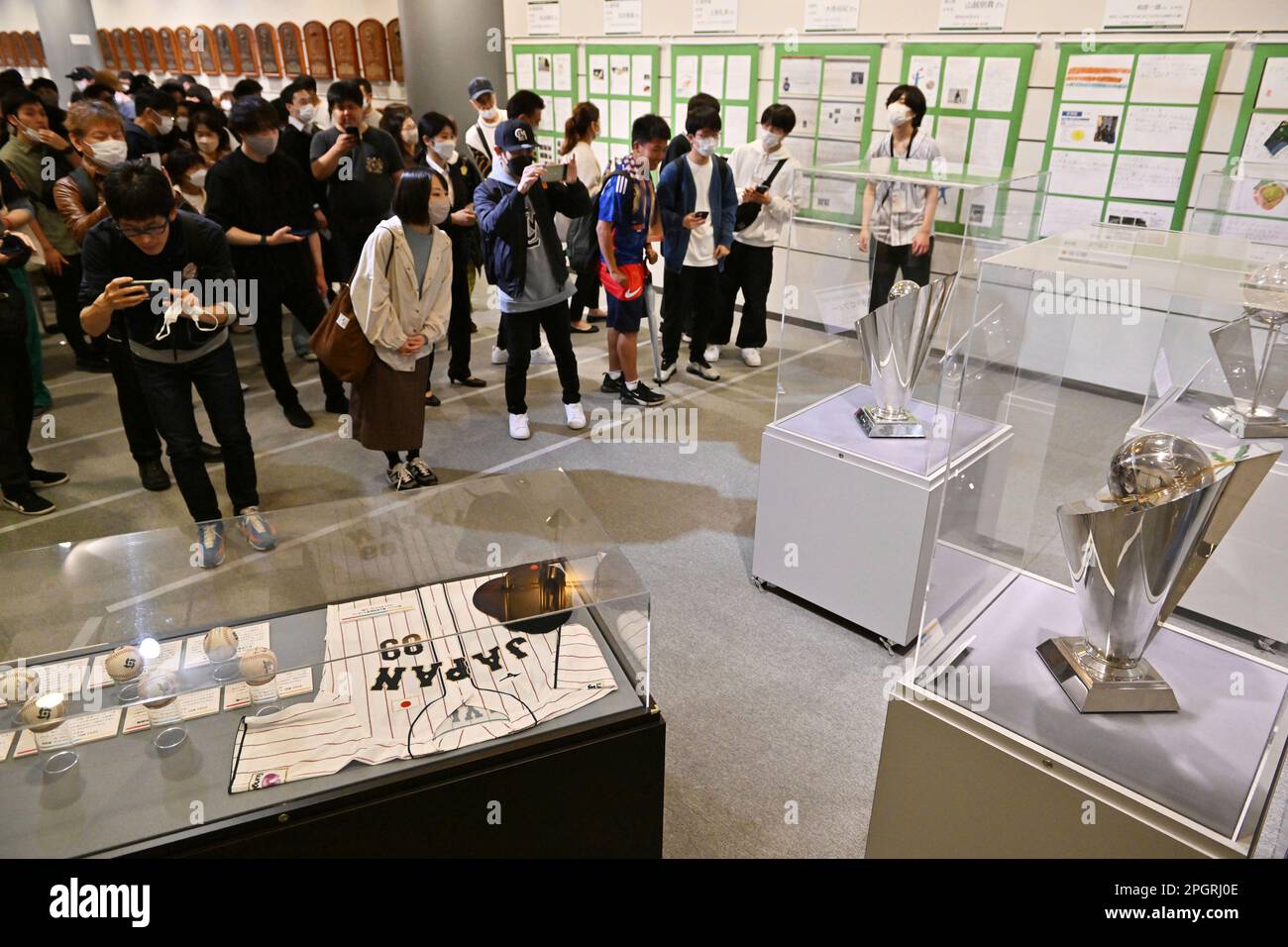 Visitors admire the World Baseball Classic (WBC) Championship Trophy, a ...