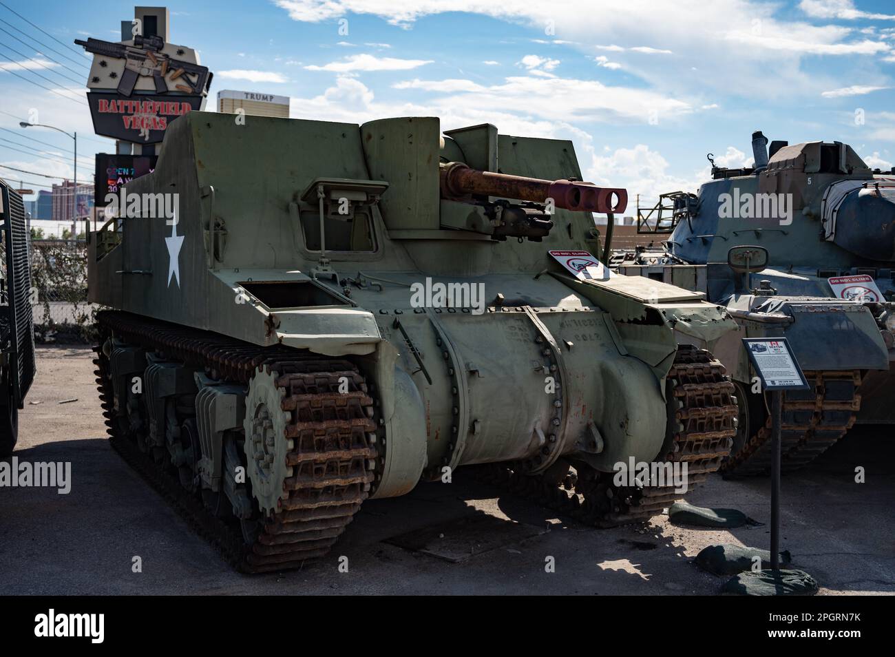 A military tank is parked in a cement lot Stock Photo - Alamy