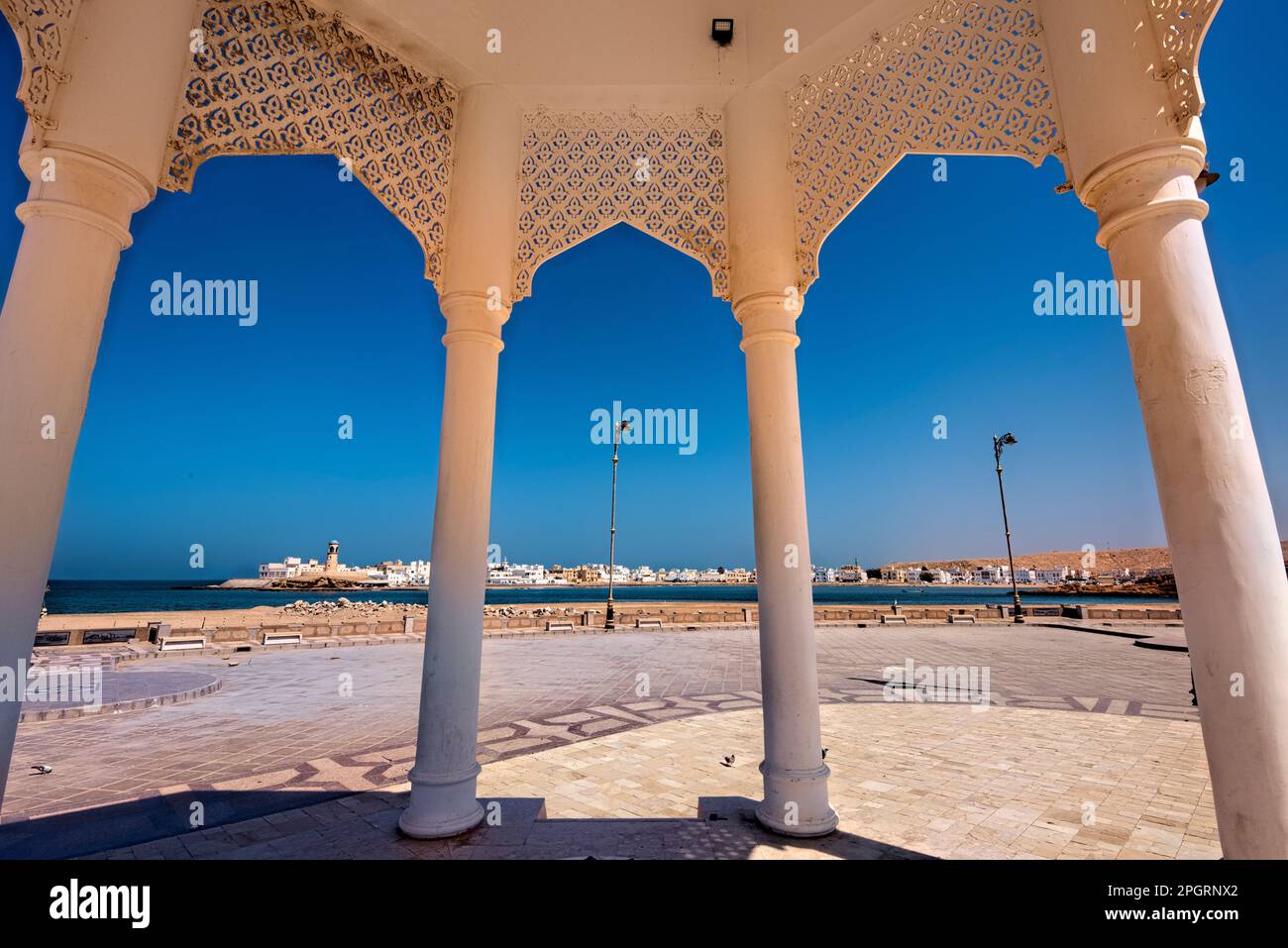 View of whitewashed houses and Al Ayjah lighthouse in Sur, Ash ...