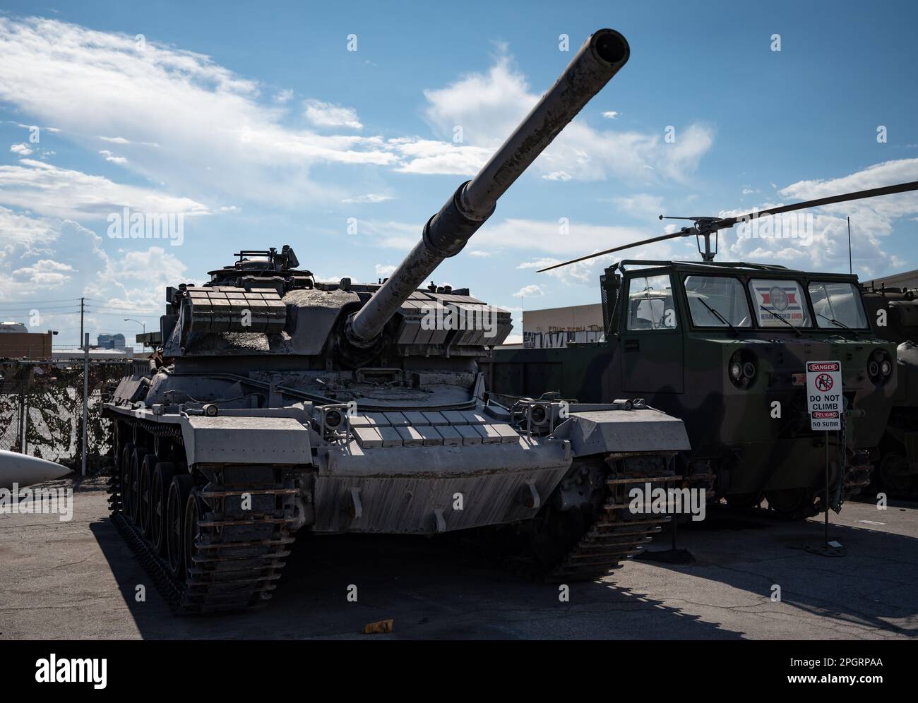 A group of military vehicles are seen here, with a large tank taking ...