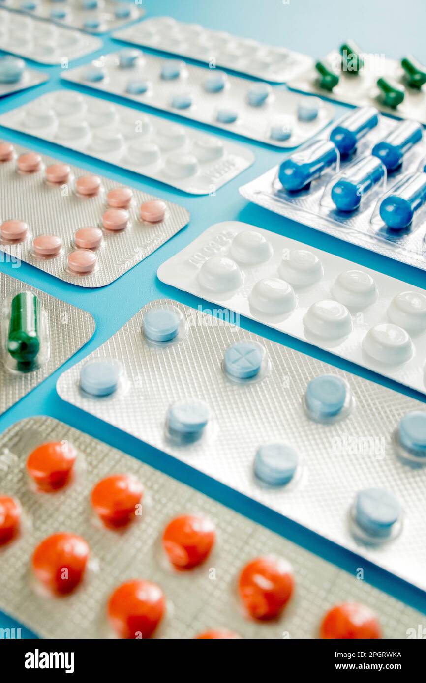 Colorful of tablets and capsules pill in blister packaging arranged ...