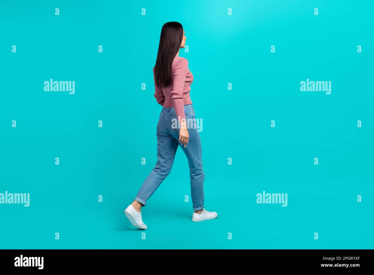 Full length profile portrait of walking young person look empty space ...